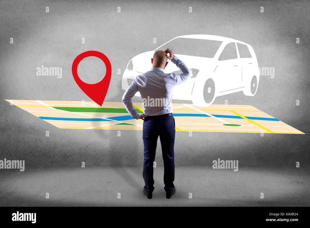 View of a Businessman in front of a wall with a Car on a map with a pin ...