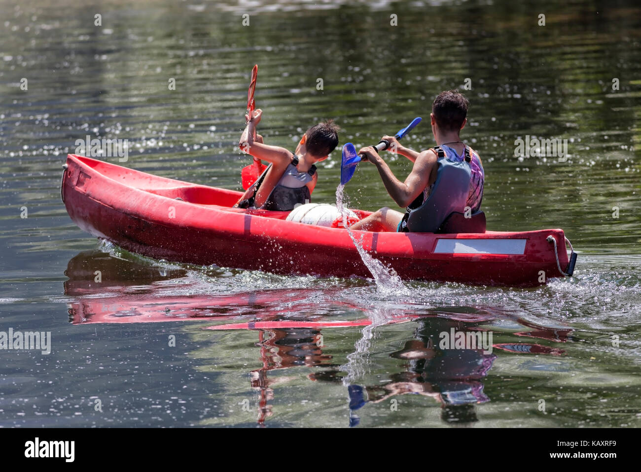 Paddling in canoeing Stock Photo - Alamy
