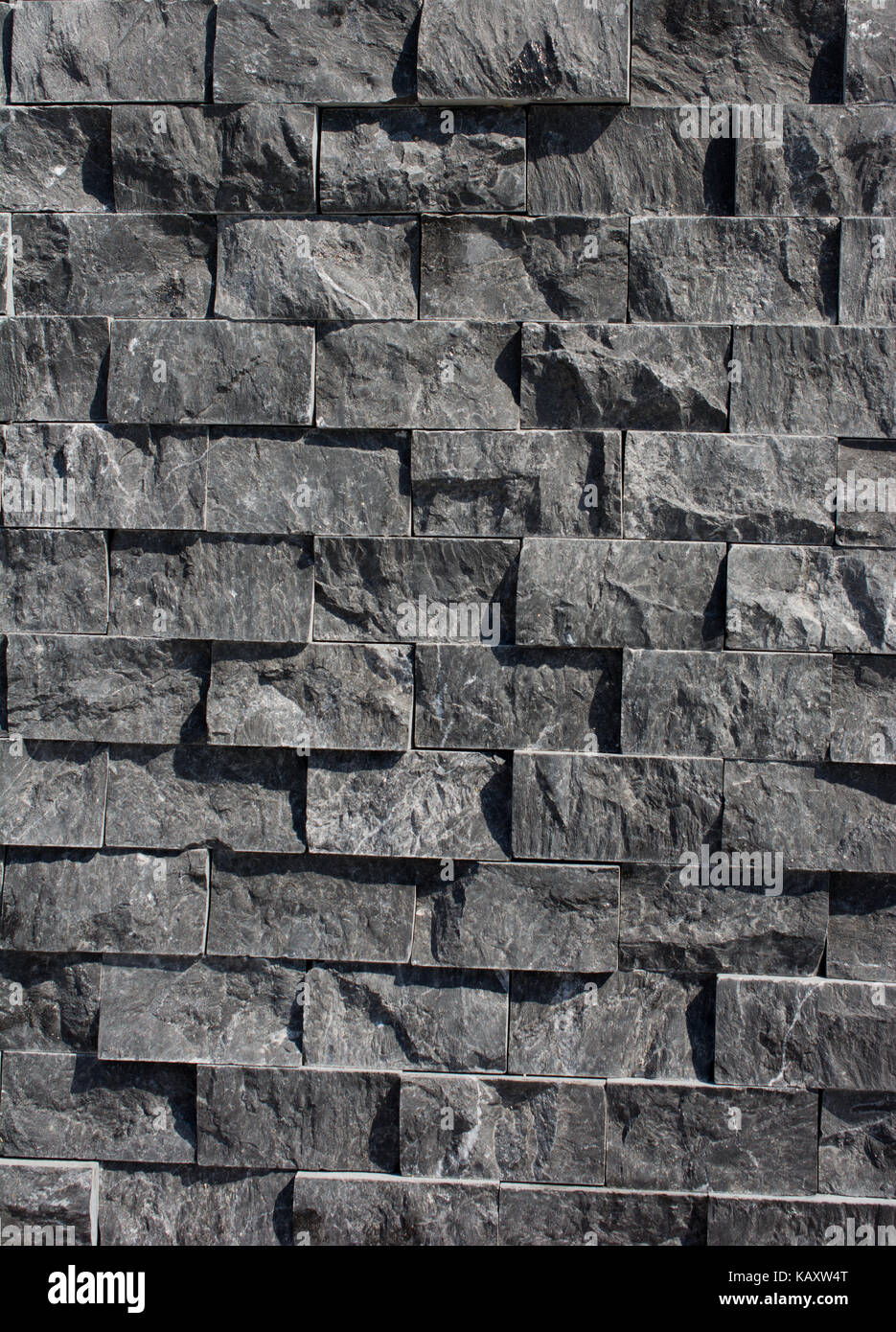 Decorative cubic stone wall as background texture Stock Photo - Alamy