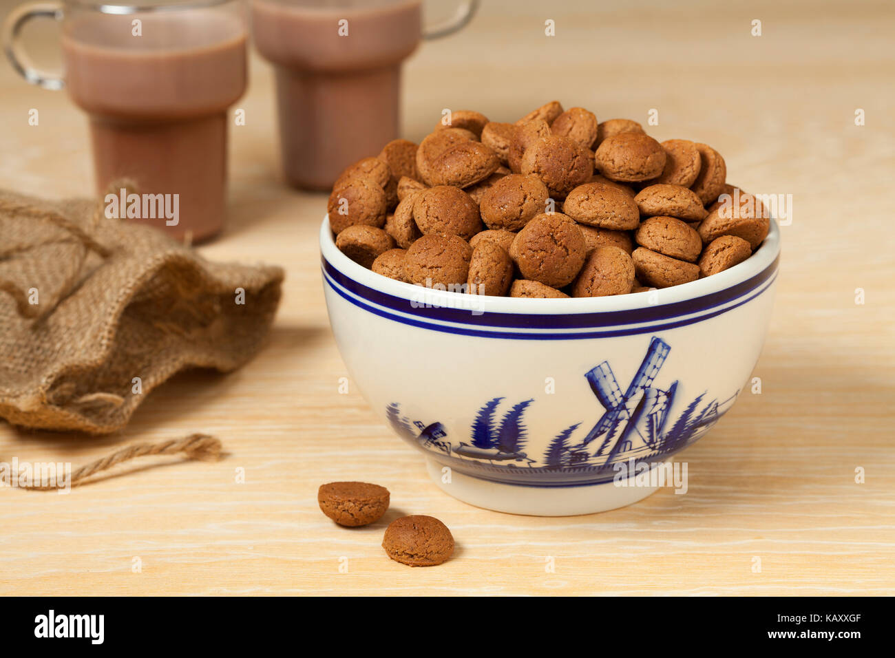Bowl with traditional Dutch gingerbread cookies and hot chocolate milk ...