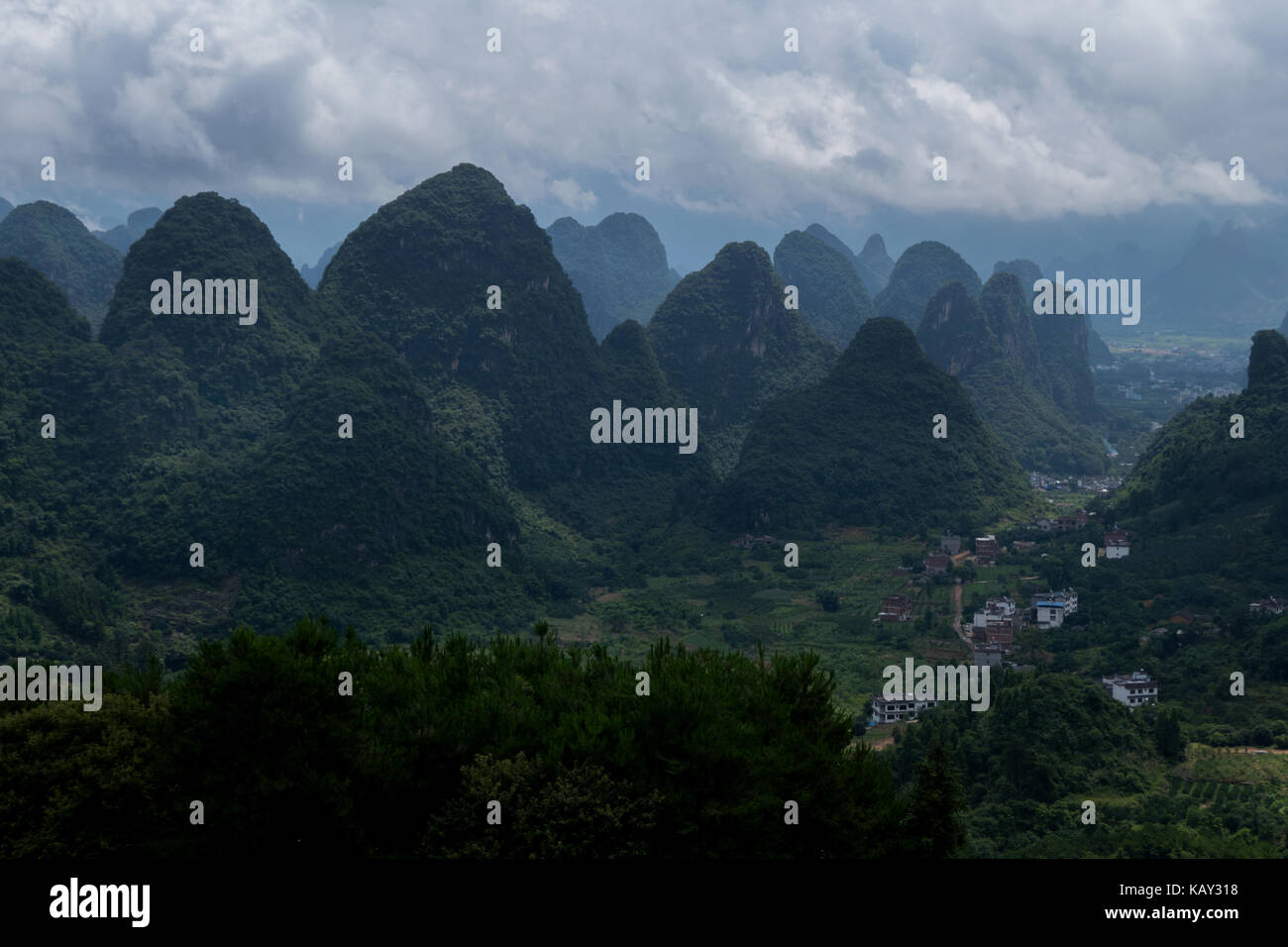 Beautiful Chinese natural landscape with karst hills, green mountains ...