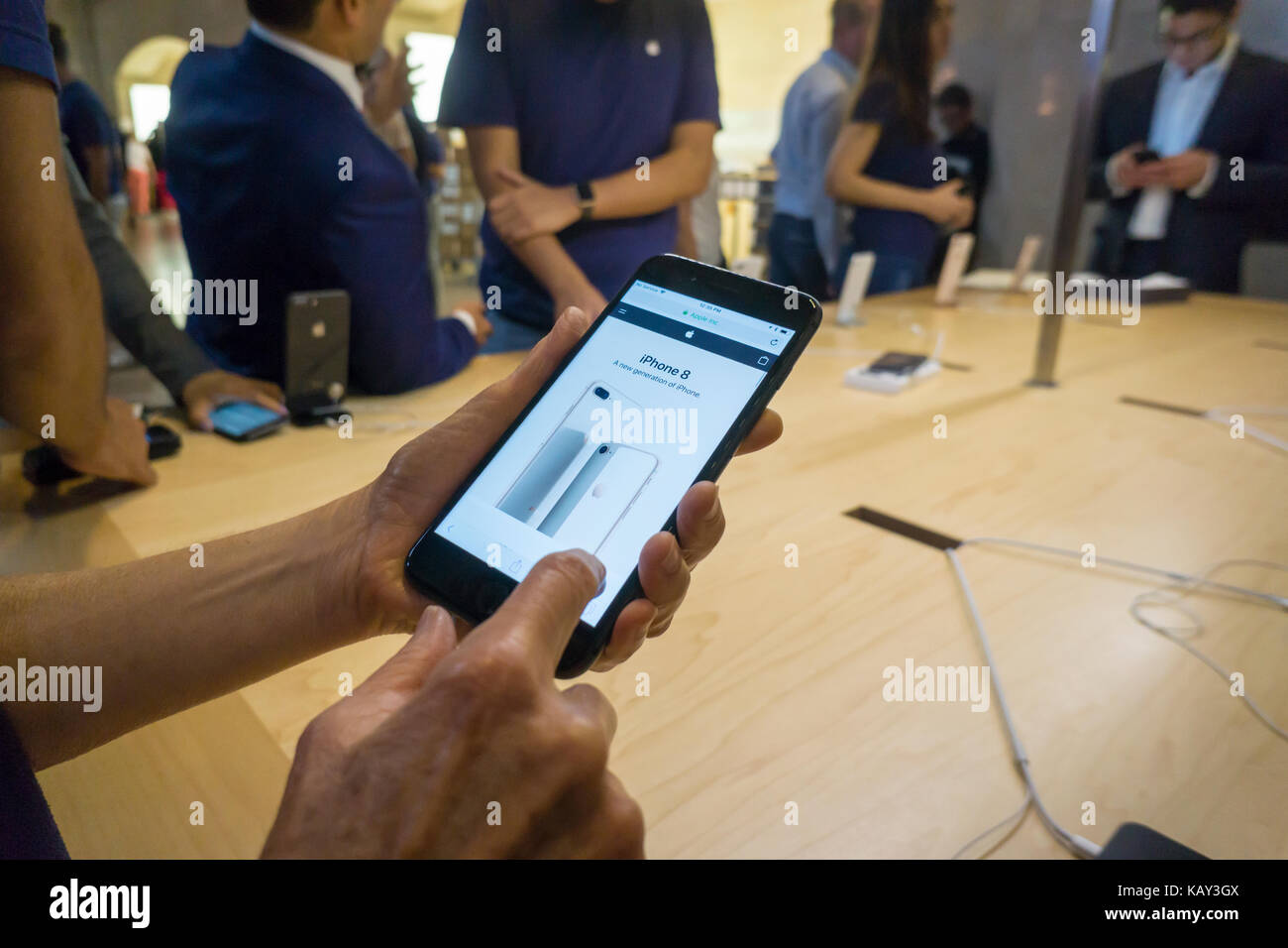 Customers in the Apple store in Grand Central Terminal in New York try ...