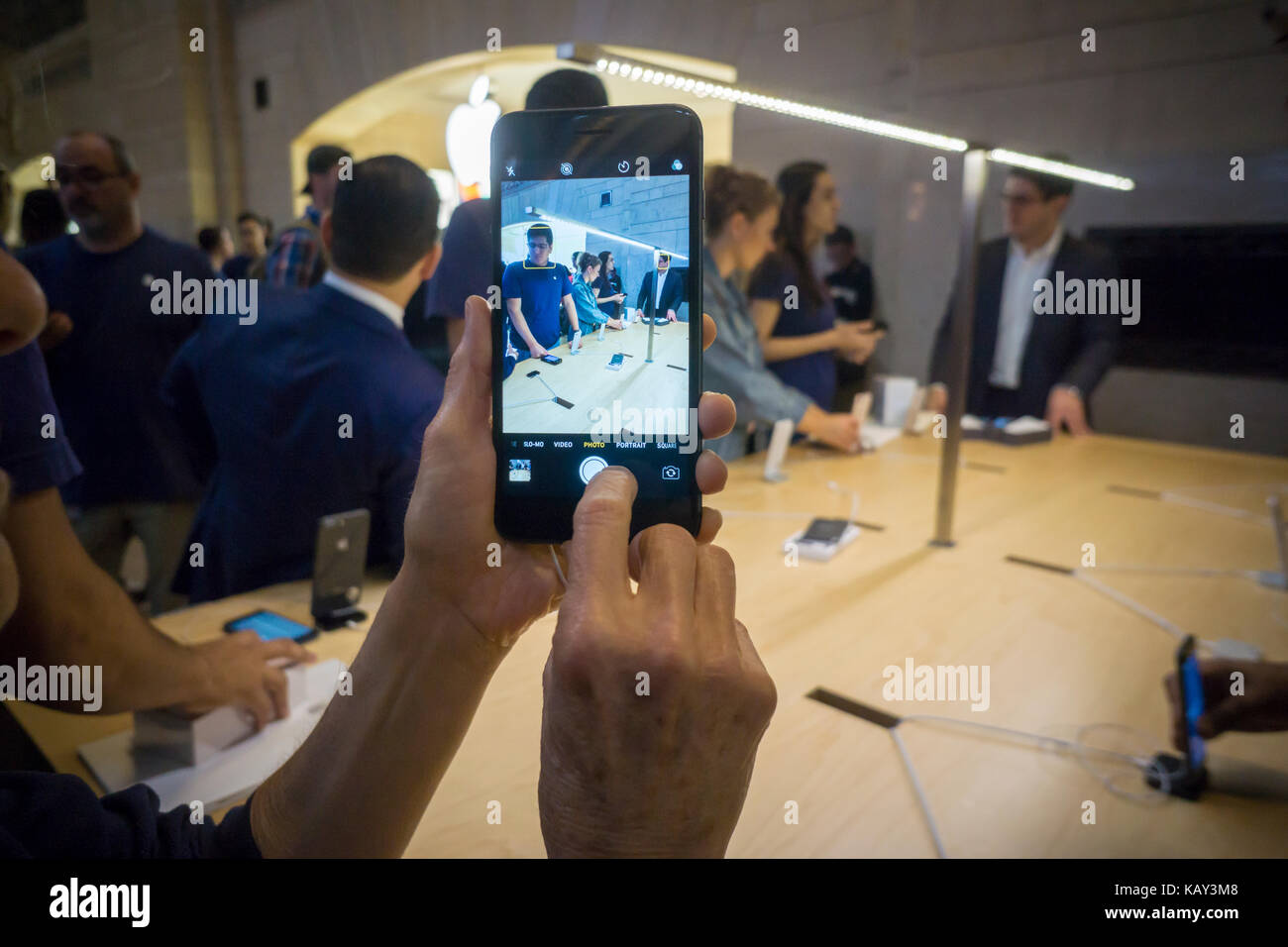 A customer in the Apple store in Grand Central Terminal in New York ...