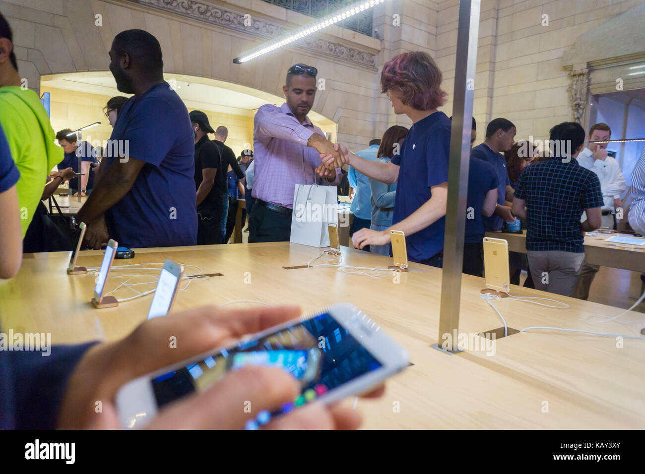A customer in the Apple store in Grand Central Terminal in New York ...