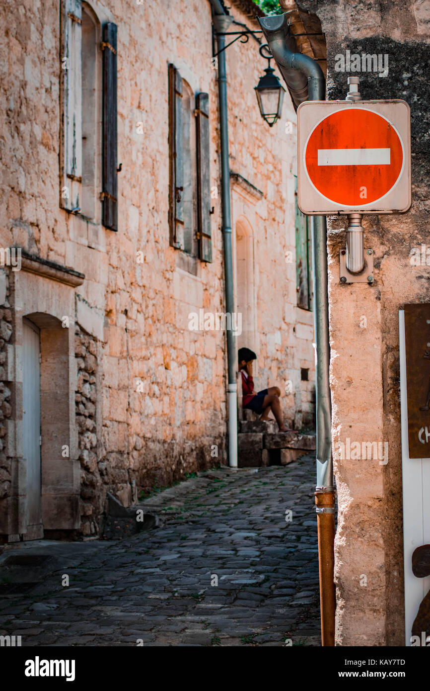 This is an image of a beautiful French street with cobble paths in a ...