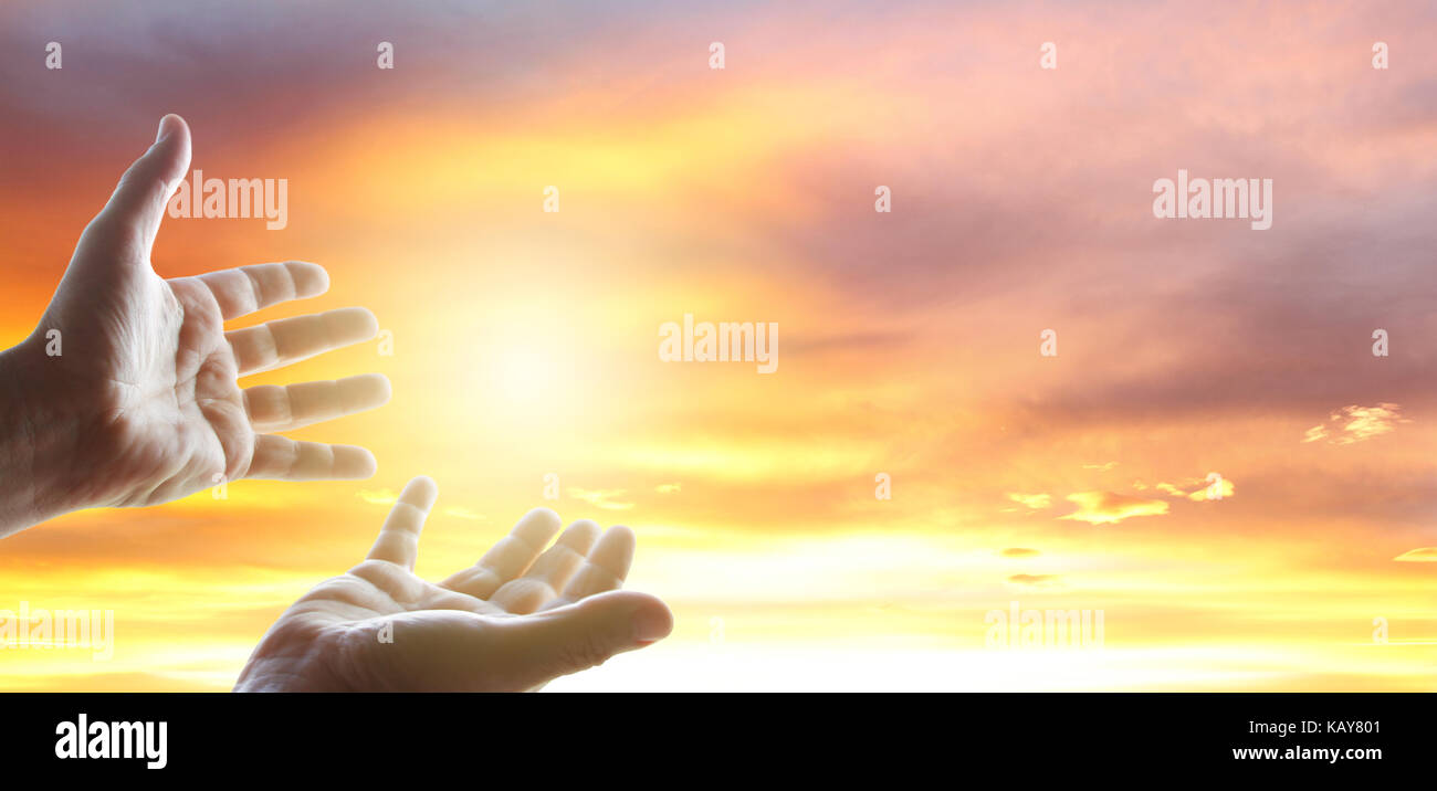 Hands reaching for the sky Stock Photo - Alamy