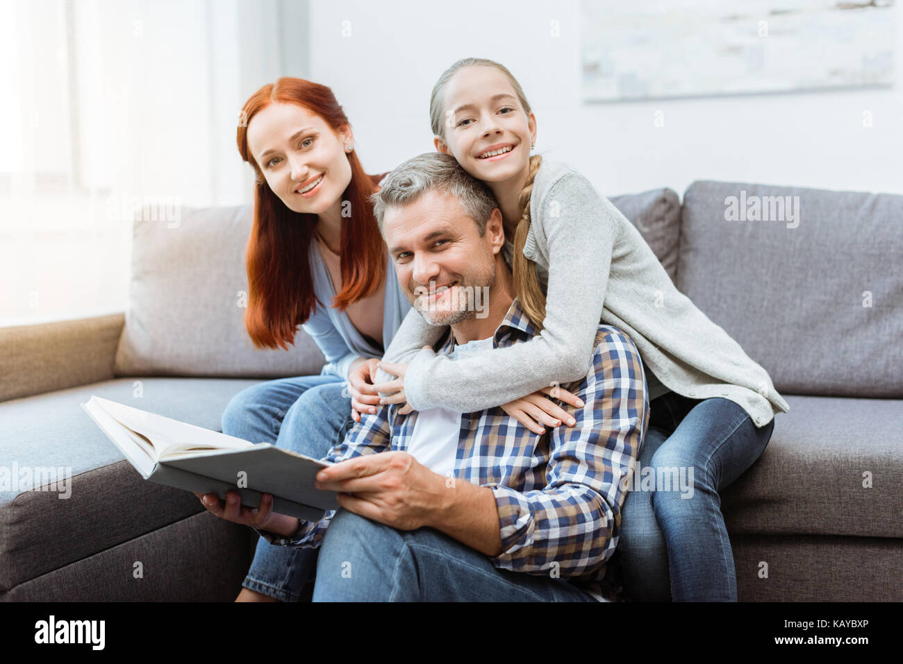 Happy family parents reading hi-res stock photography and images - Alamy