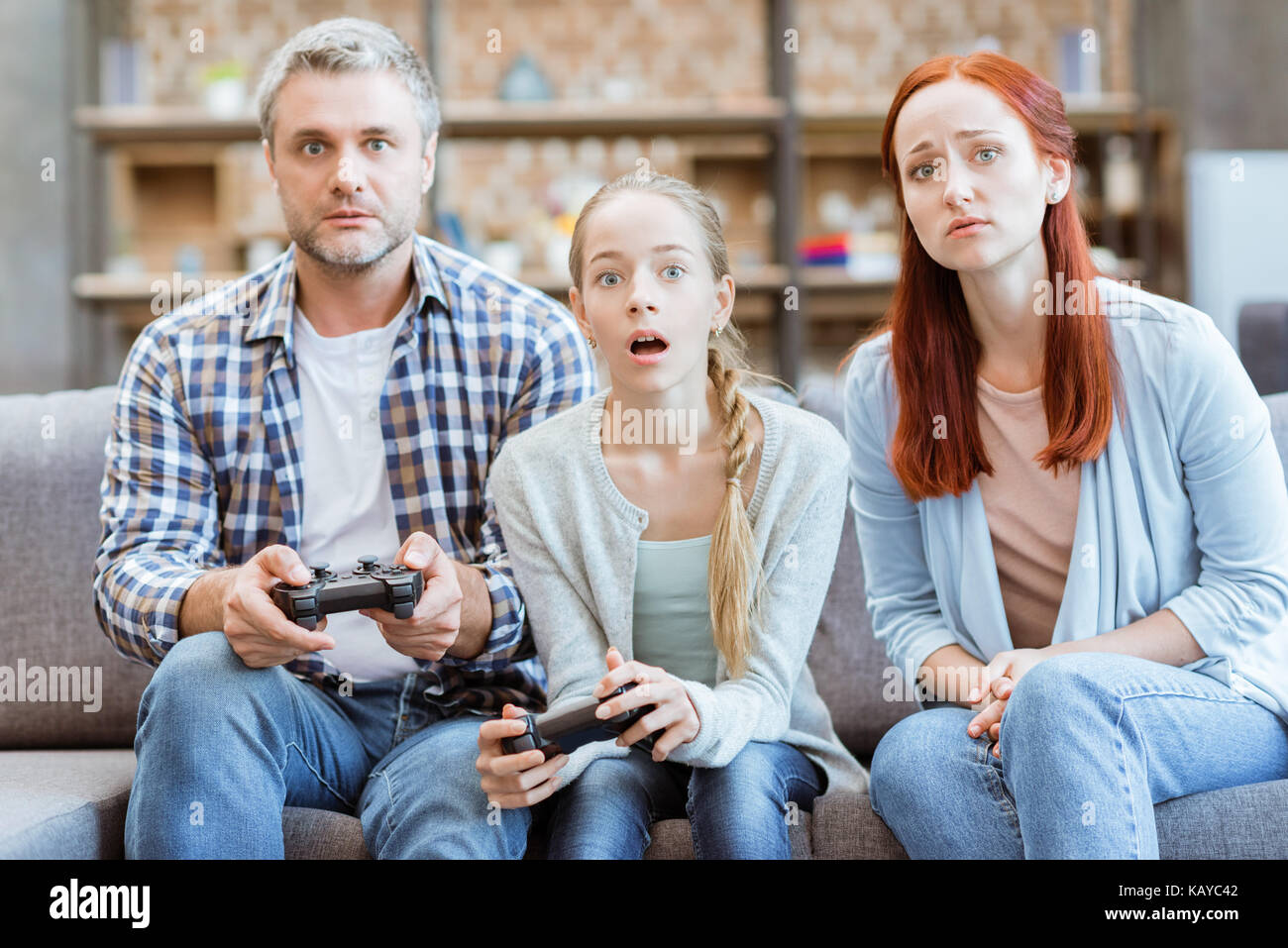 family playing video game Stock Photo - Alamy
