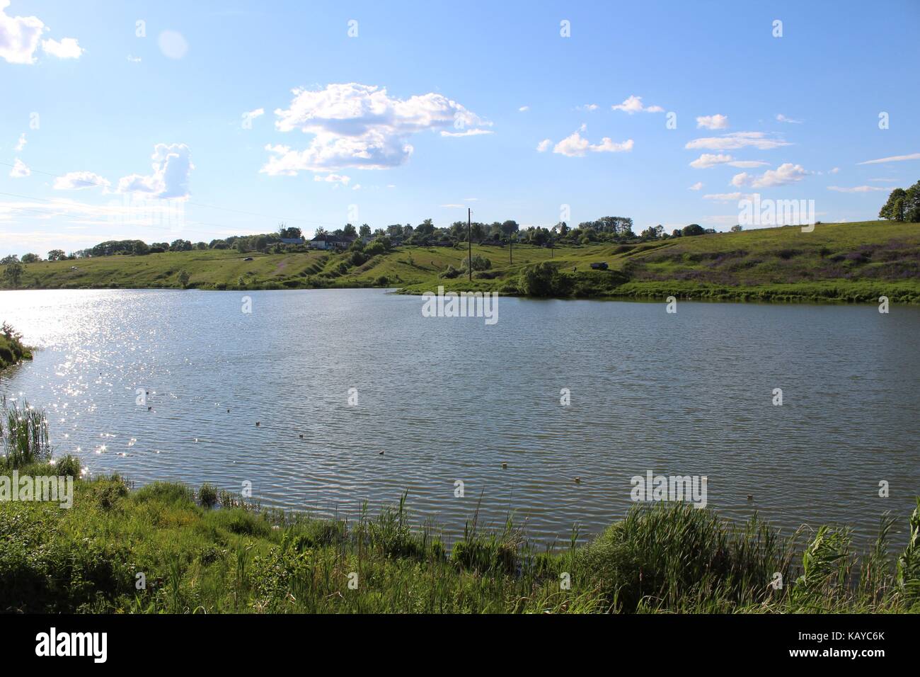 The lake is in good sunny weather. The water is riddled with a slight ...