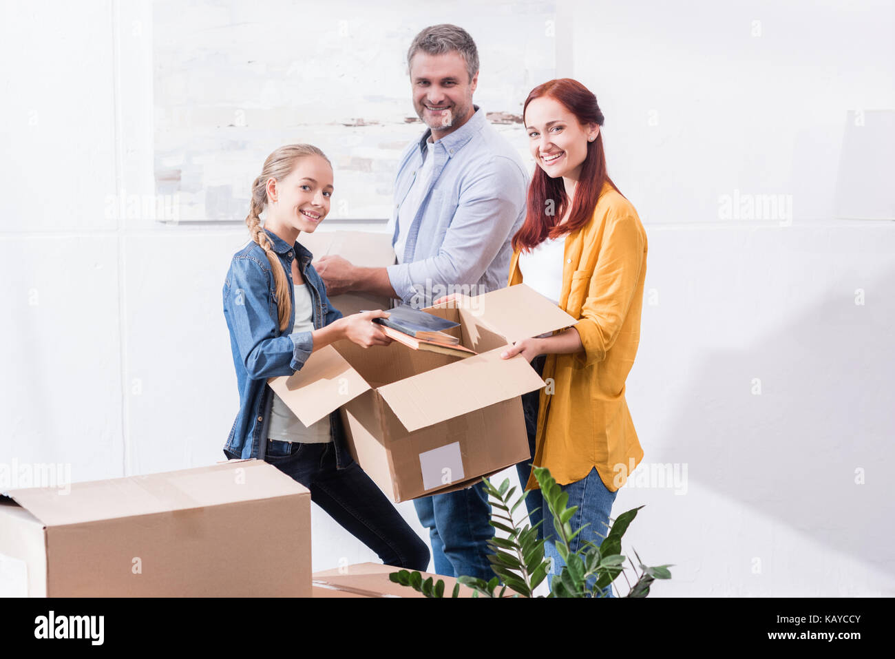 family moving to new home Stock Photo - Alamy