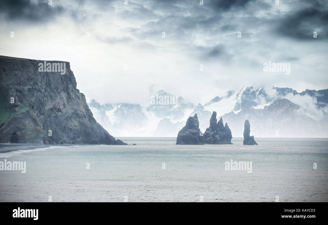 Famous Reynisdrangar rock formations at black Reynisfjara Beach. Coast ...