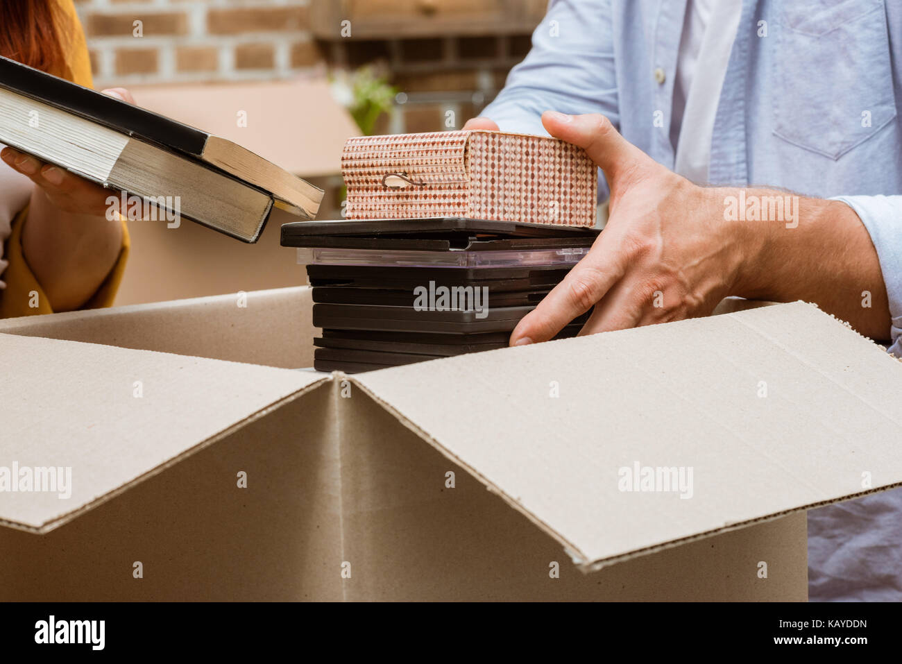 Couple unpacking box hi-res stock photography and images - Alamy