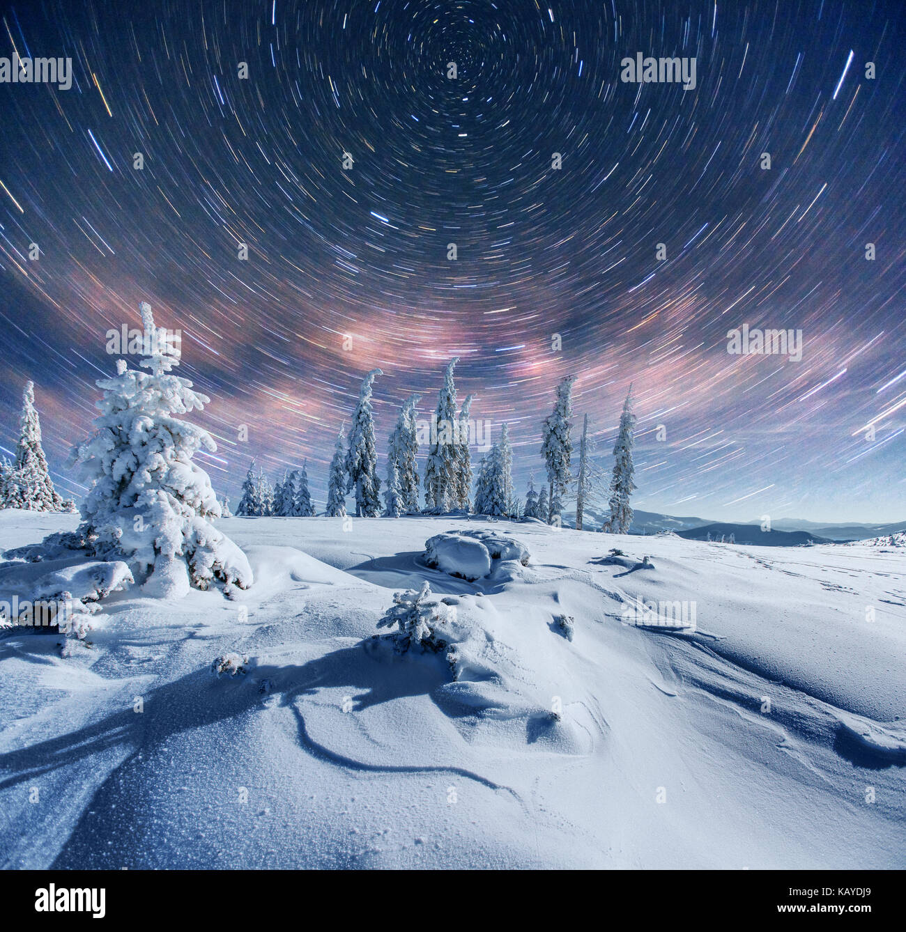 starry sky in winter snowy night. fantastic milky way in the New Year's Eve. In anticipation of ...