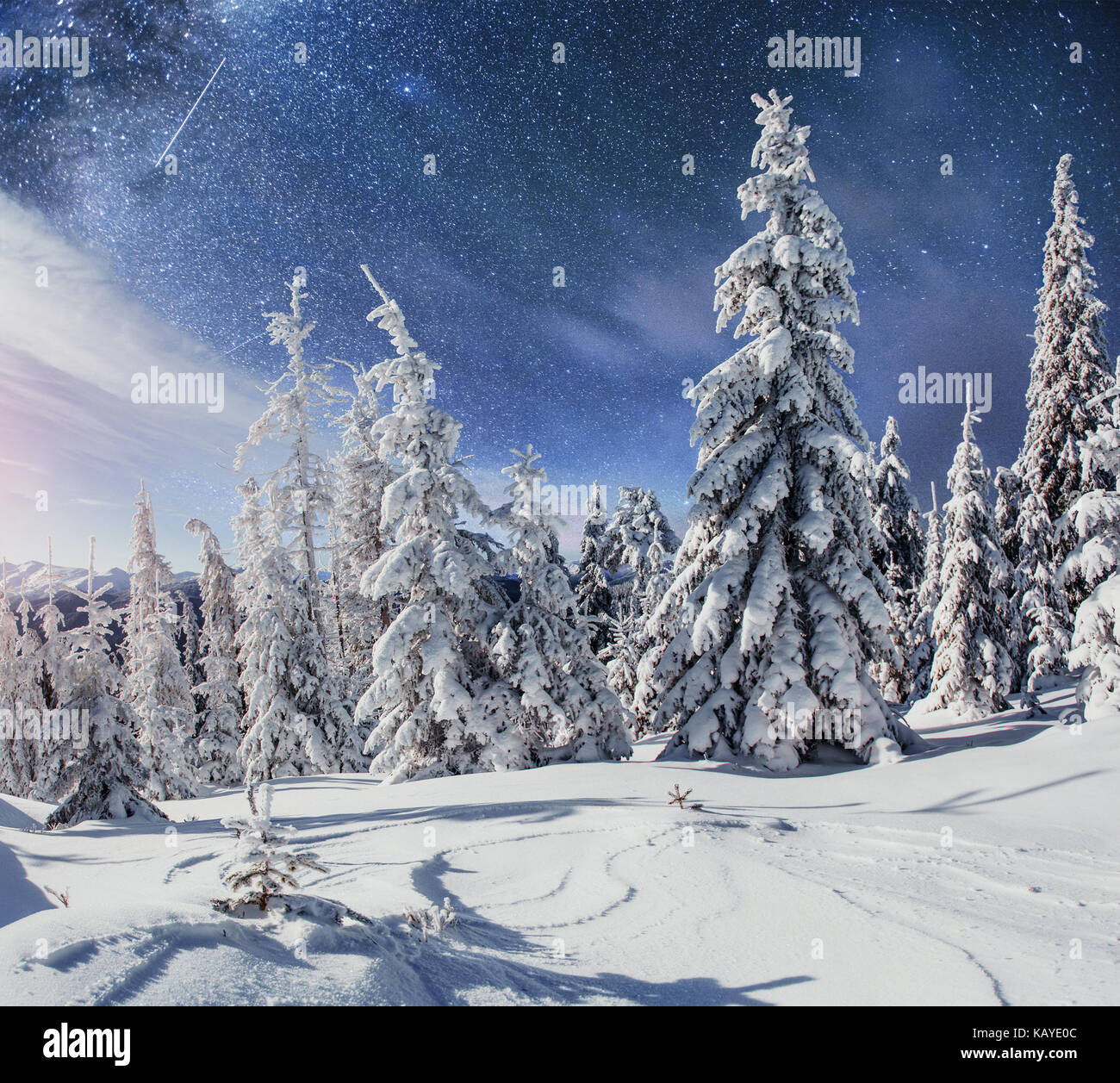 starry sky in winter snowy night. fantastic milky way in the New Year's Eve. In anticipation of ...