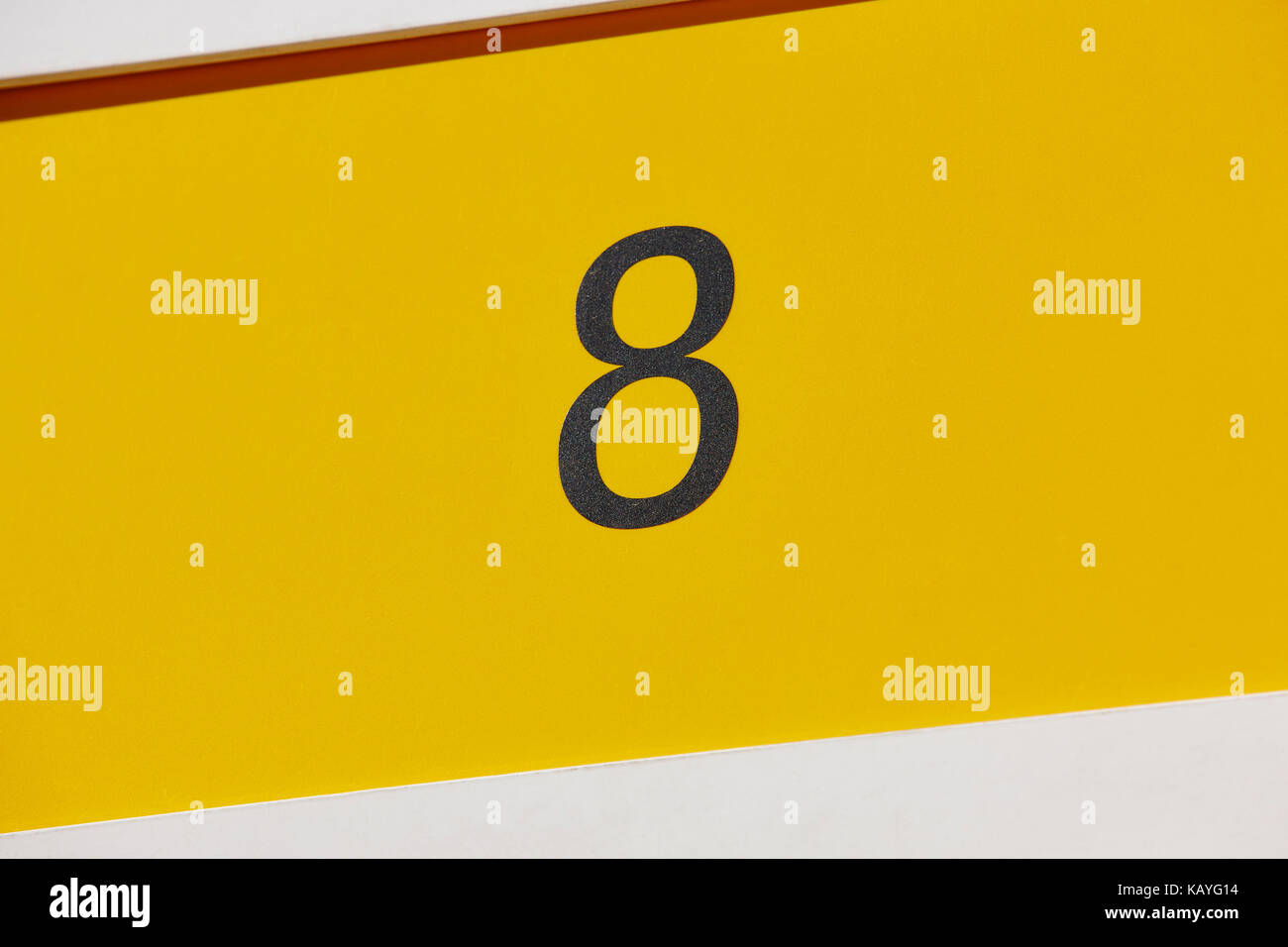 Hotel room number eight, yellow background. Vacation Stock Photo - Alamy
