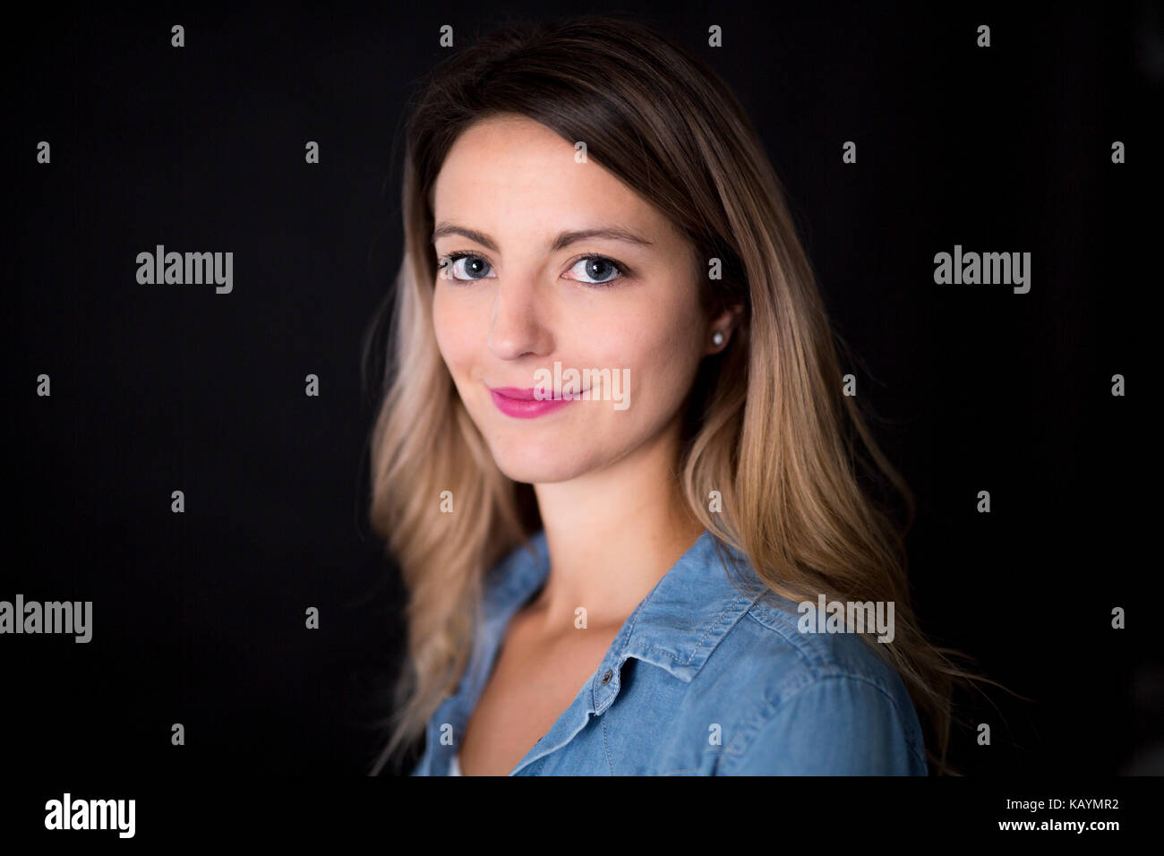 Attractive female on black background Stock Photo - Alamy