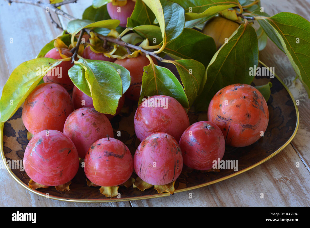 Persimmons, also known as Sharon fruit or Kaki Stock Photo - Alamy