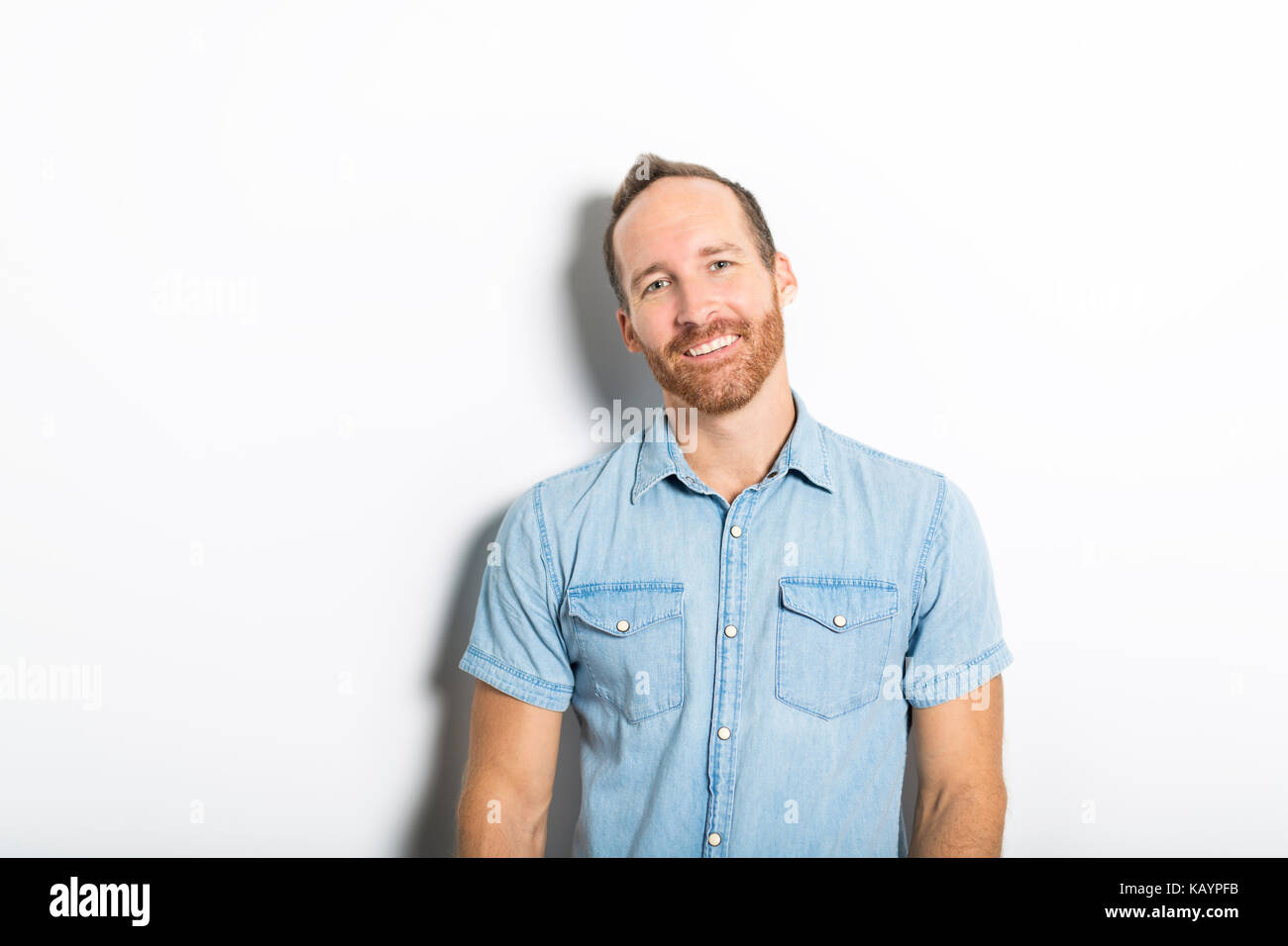 Portrait of a men in studio gray background Stock Photo - Alamy