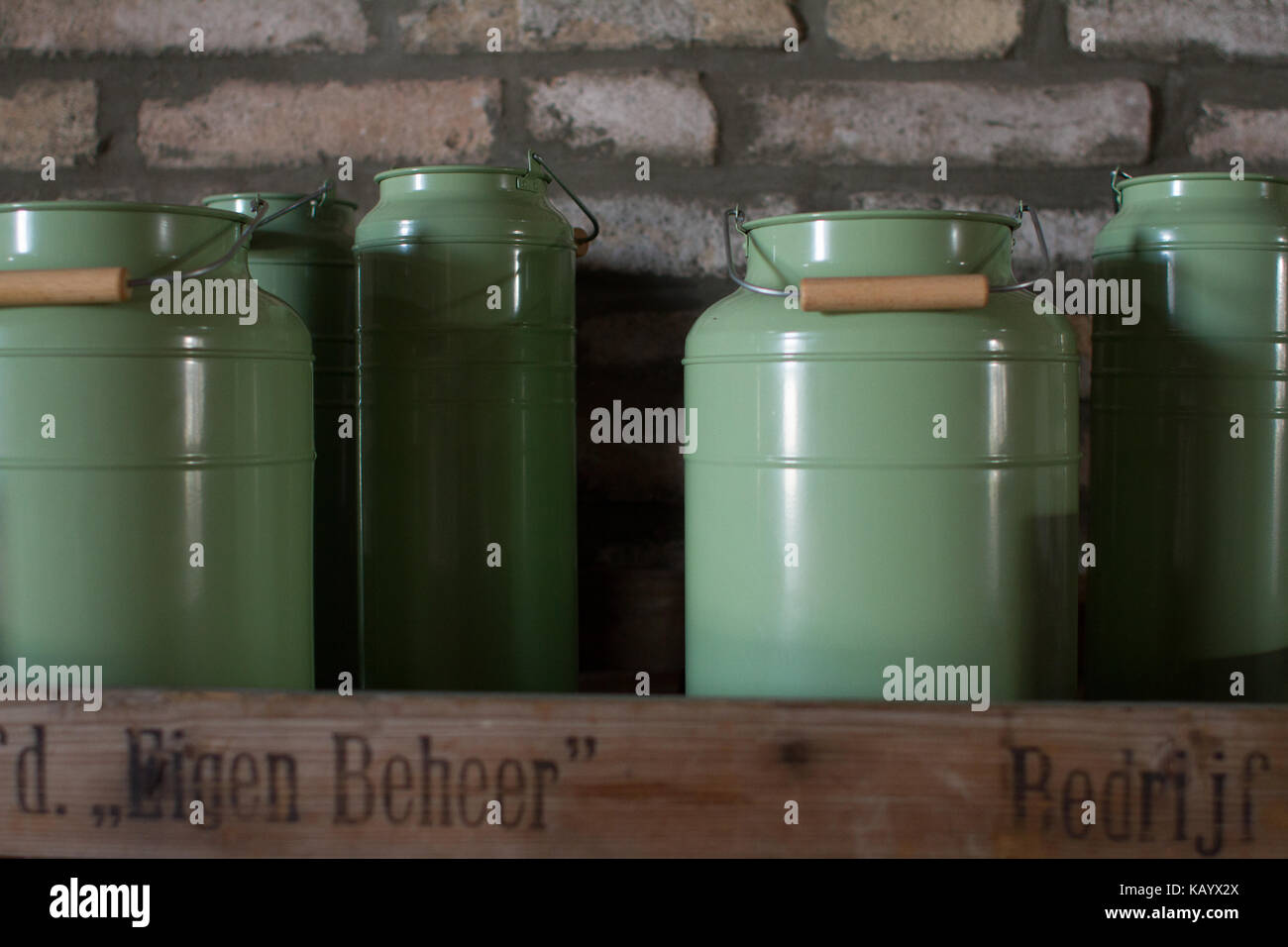 Old tin beer containers on a wood shelf inside an old canteen Stock ...