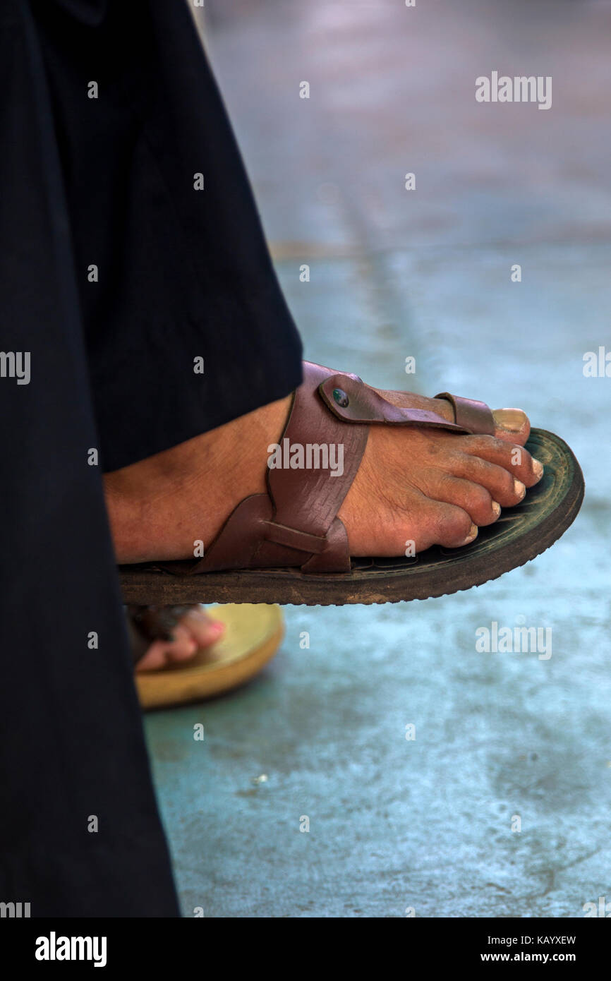 Close up view at man wearing sandals Stock Photo - Alamy