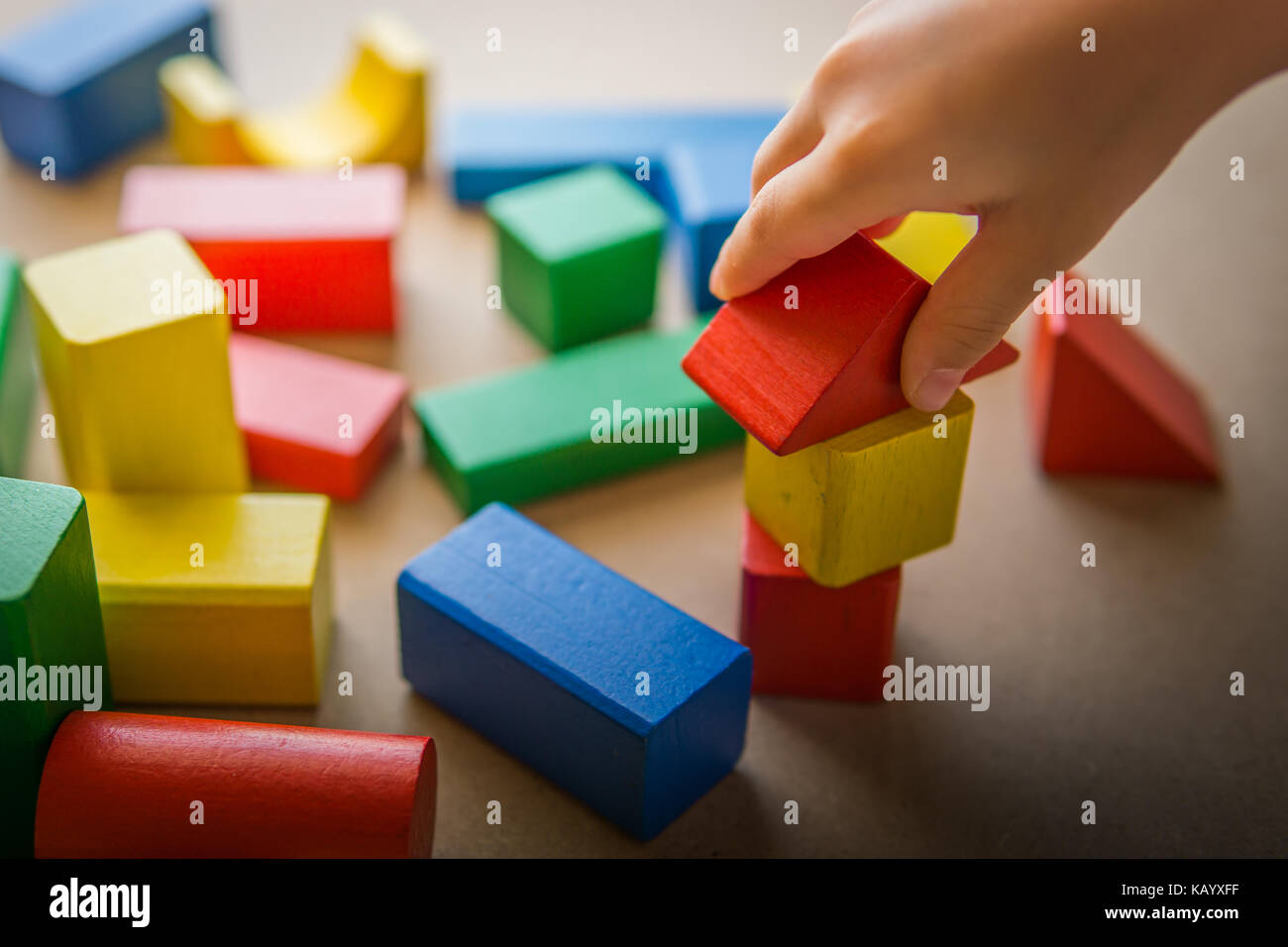 Kid Play Wooden Blocks Stock Photo - Alamy