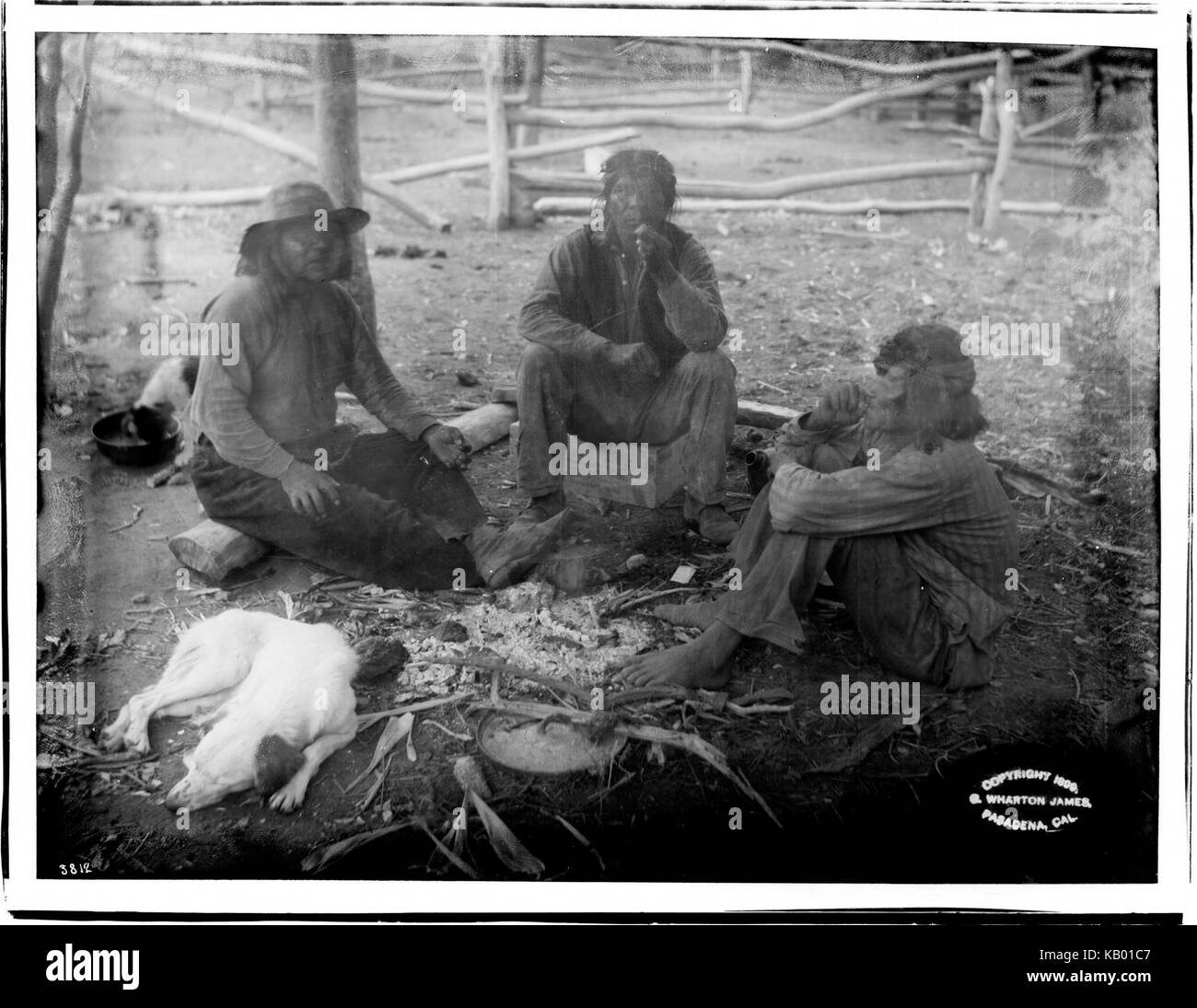 Three Havasupai Indian man sitting around a campfire telling stories ...