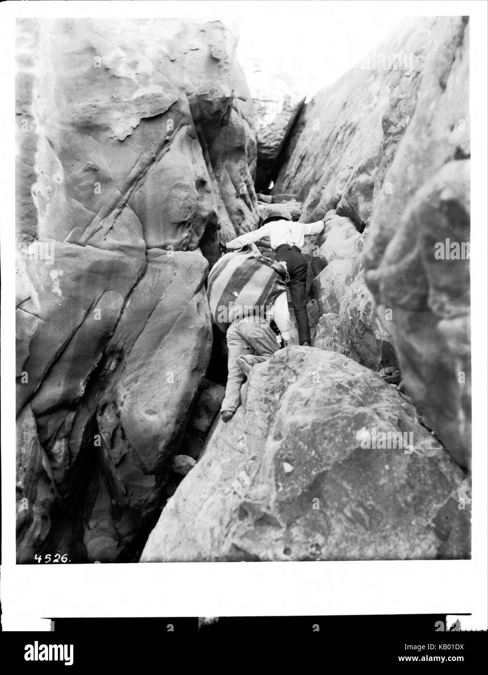 Two Acoma Indian men climbing up the Acoma Trail, 1886 (CHS 4526 Stock ...