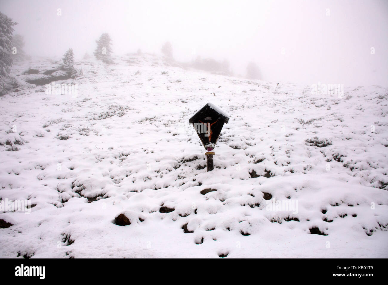 Jesus Christ carving statue in snow on top of mountain in Kaunergrat ...