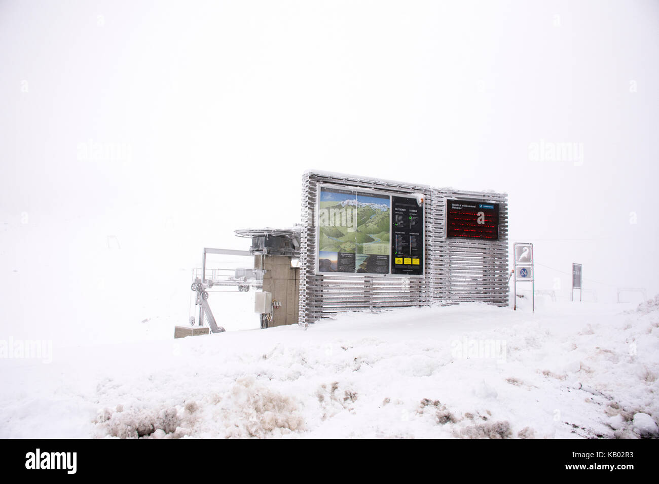 Information board at top of mountain with snowing covered on floor at ...