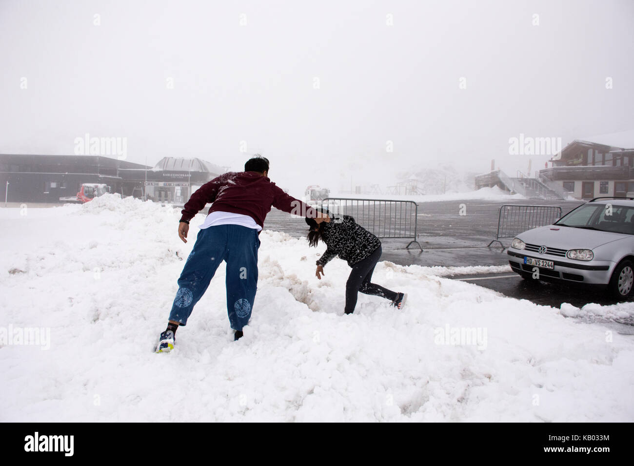 Asian thai family people playing snow at top of mountain in Kaunergrat ...