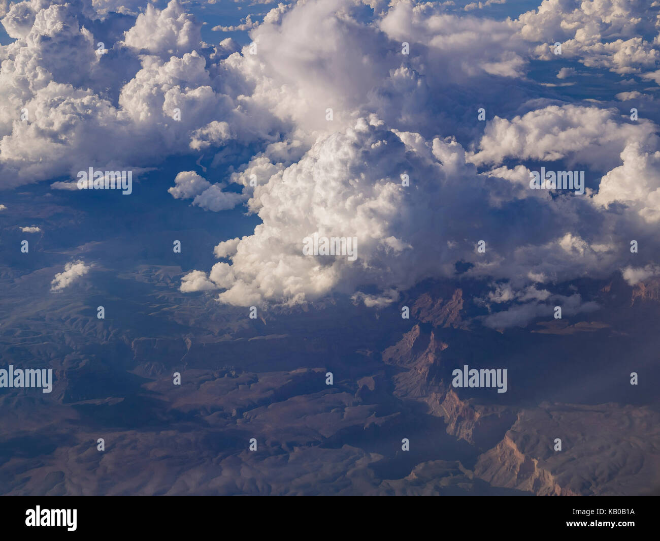 Aerial view of mountain landscape, view from window seat in an airplane ...