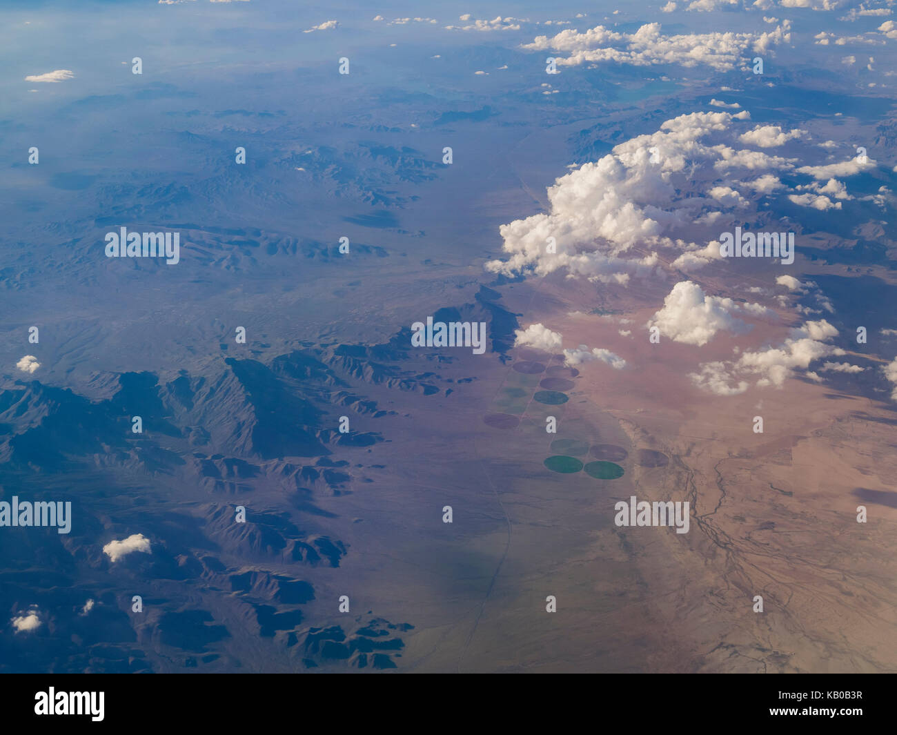 Aerial view of mountain landscape, view from window seat in an airplane ...