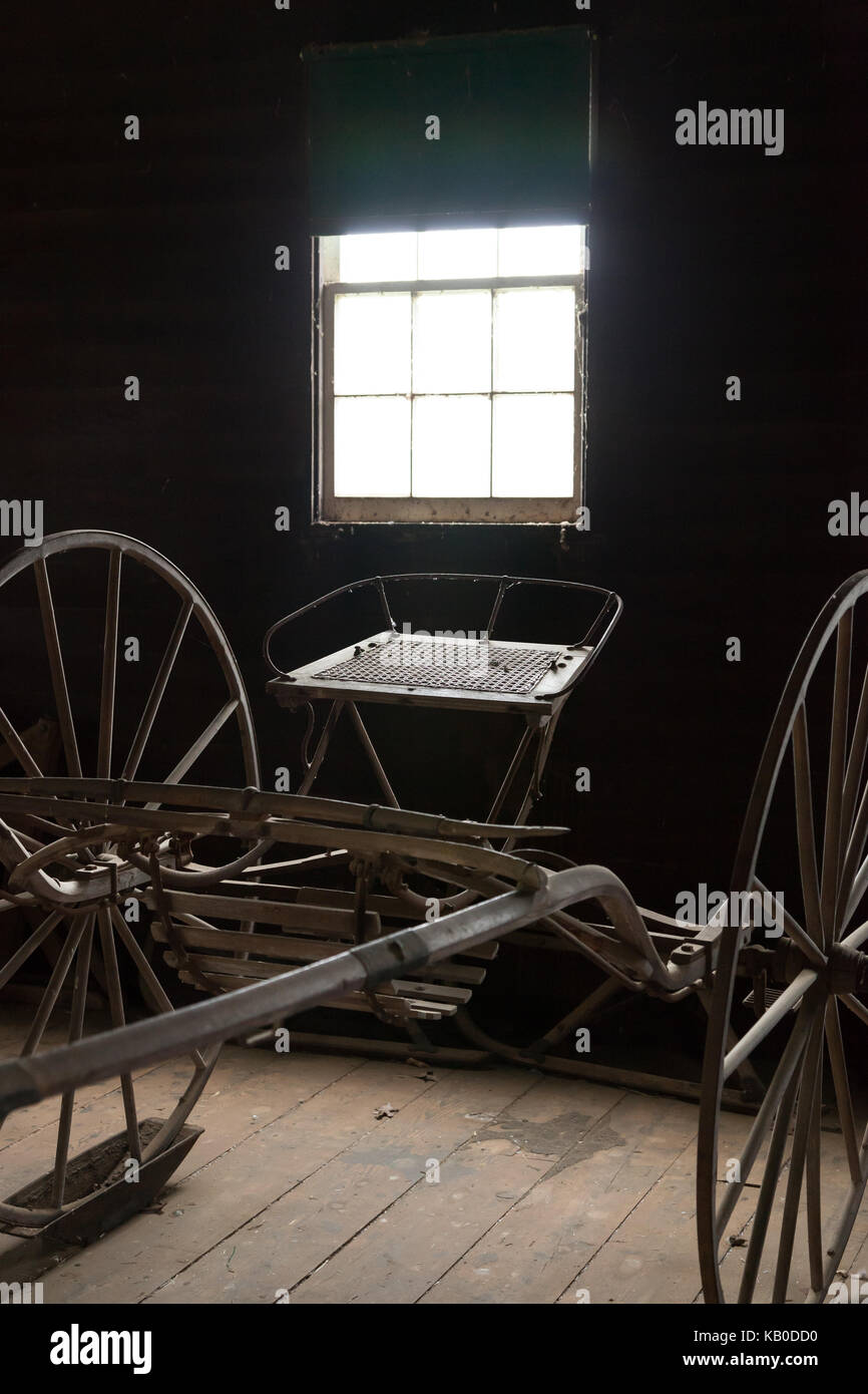 An old sulky wagon is stored in a barn Stock Photo - Alamy