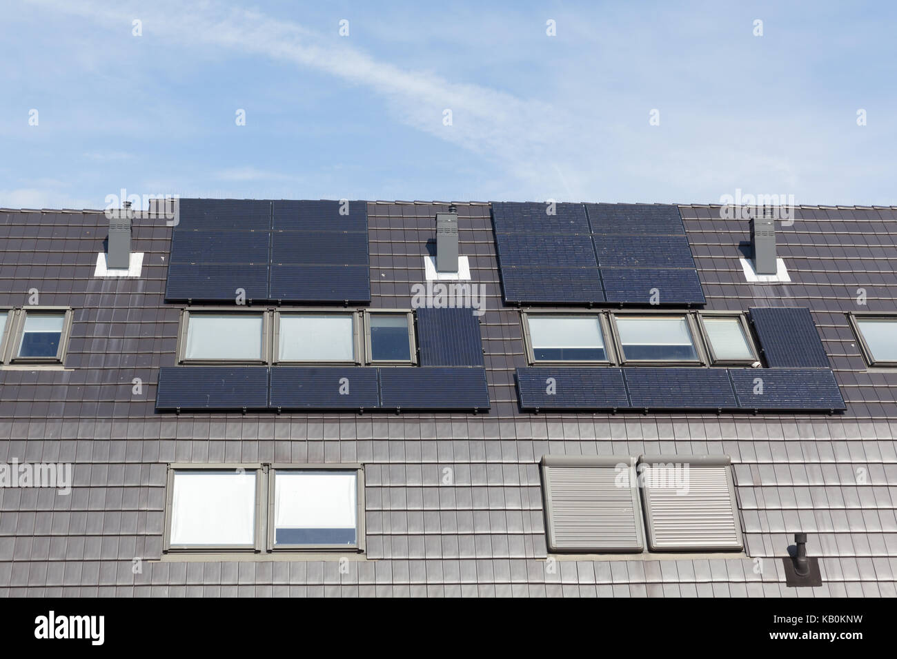 Modern house with solar panels for alternative energy Stock Photo - Alamy