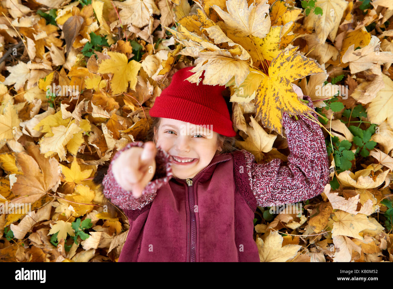 girl lie on back in autumn forest on yellow leaves background Stock ...