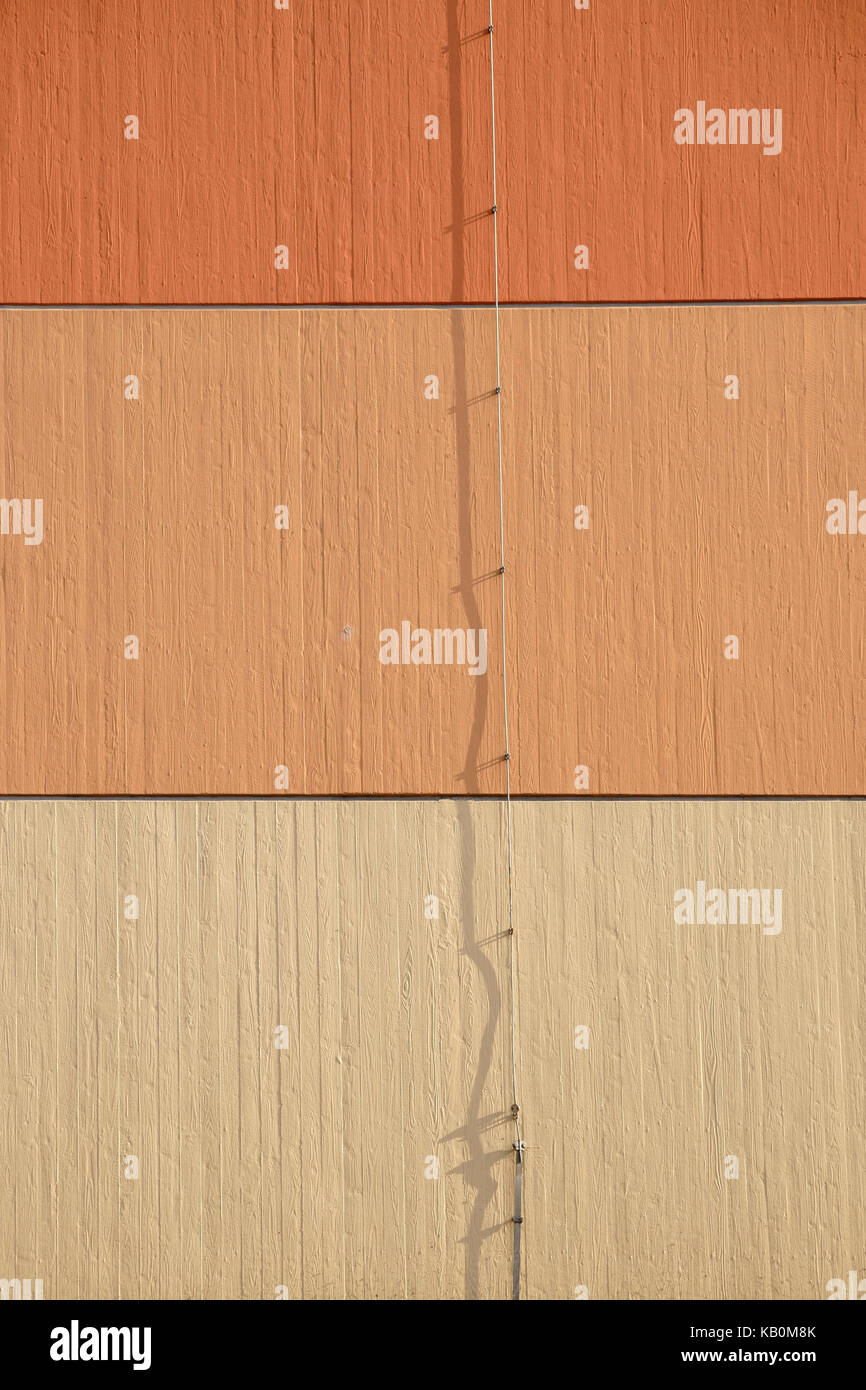 A lightning conductor cable cast a shadow on the modern facade of a ...