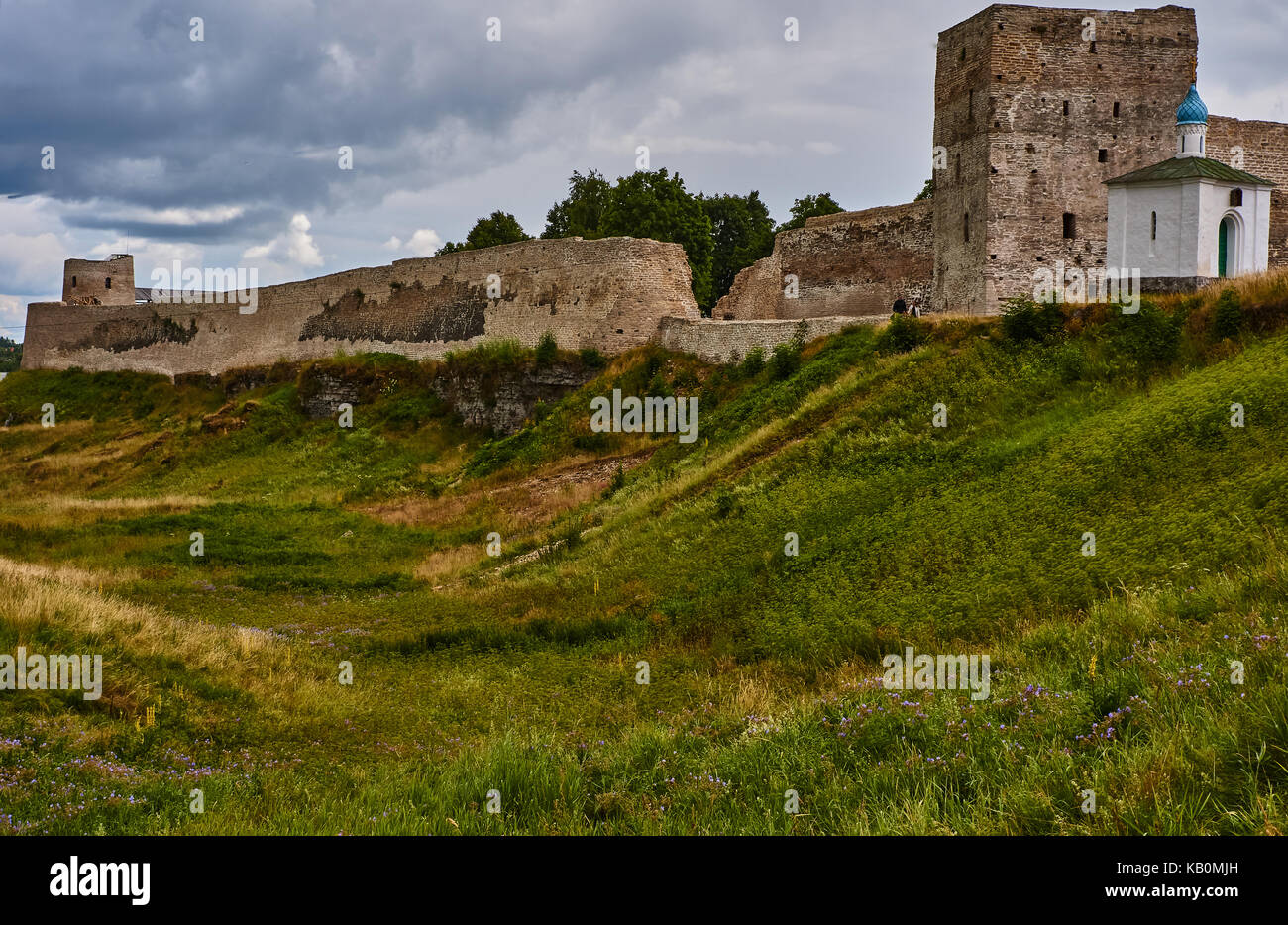 On the hill there is an ancient fortress. The wall is partially ...