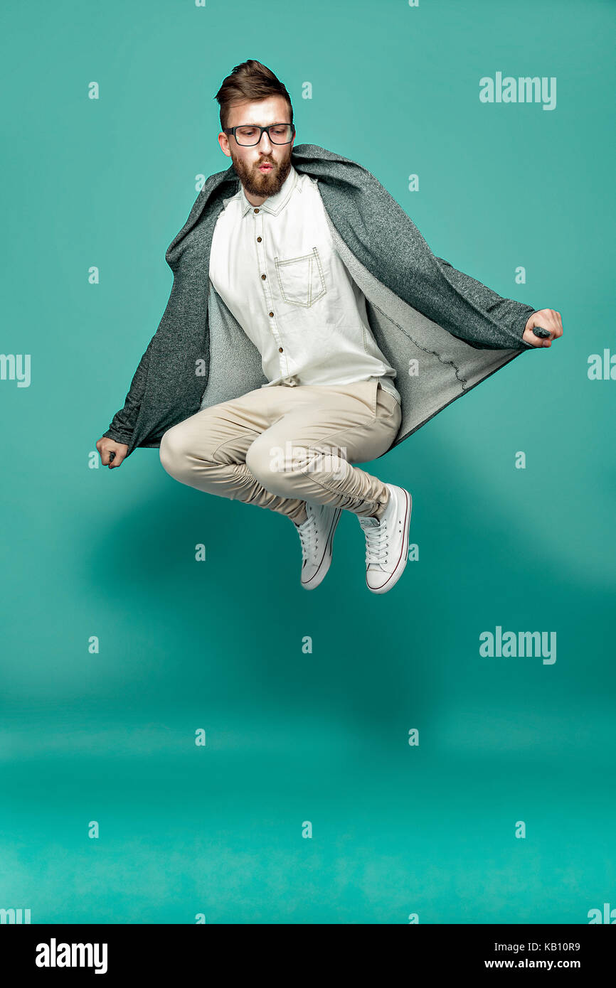 Young man jumping Stock Photo - Alamy