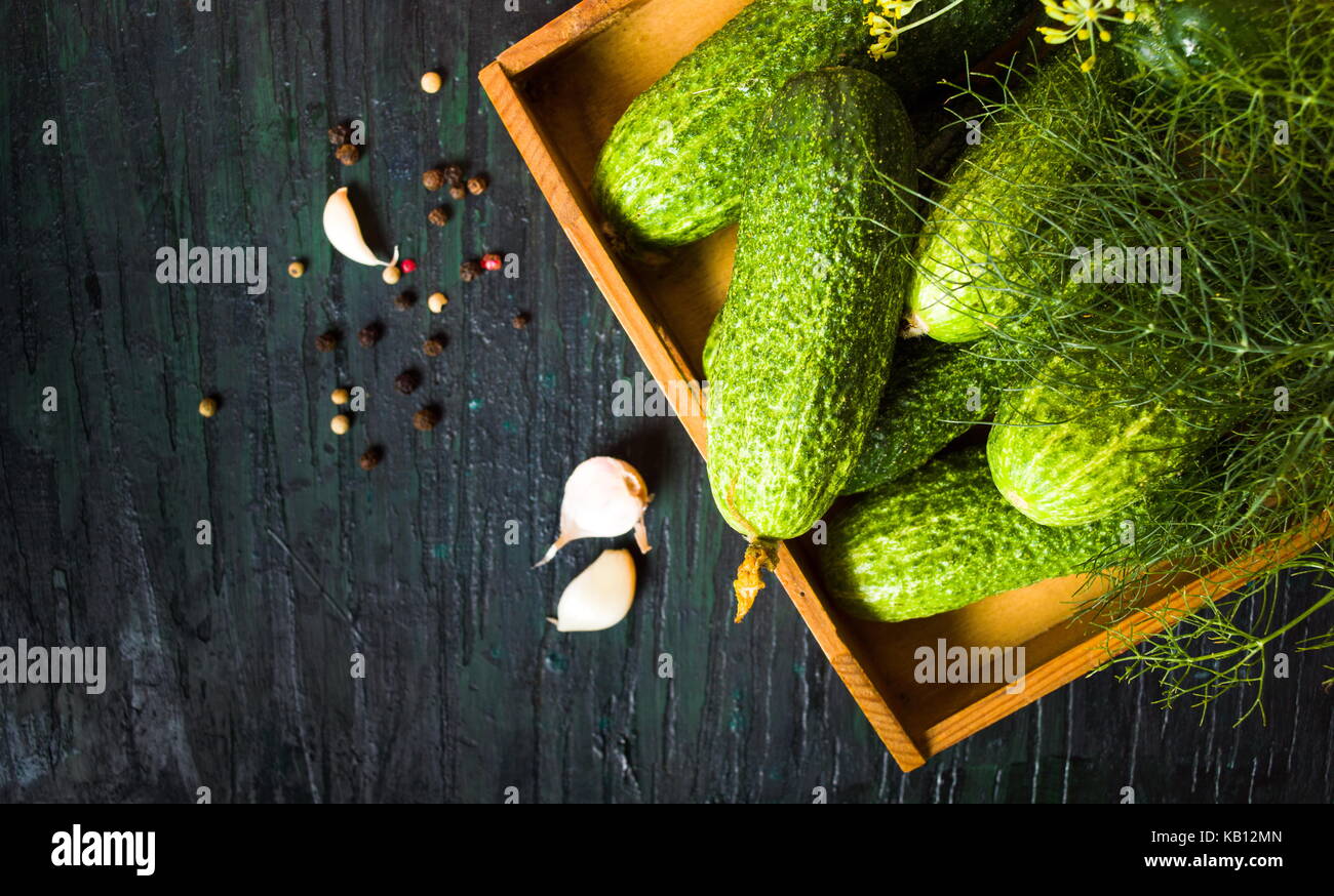 Fresh cucumbers on a rustic wooden table Stock Photo - Alamy