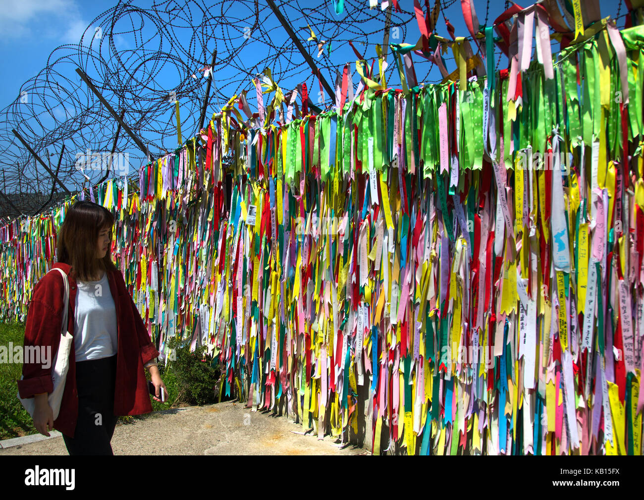 Messages of peace and unity written on ribbons left on fence at dmz ...