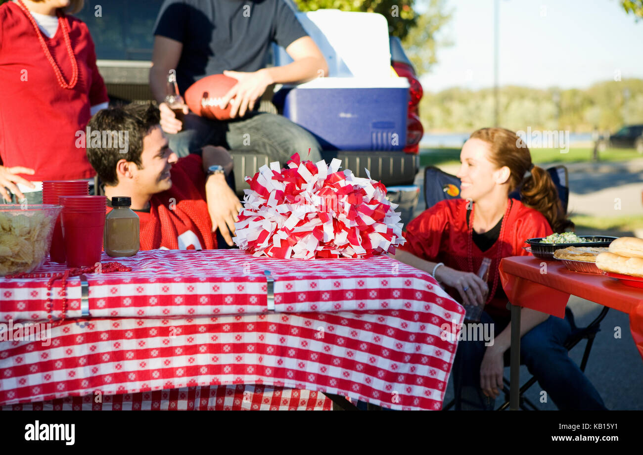 Group of friends at a football tailgating party outside Stock Photo - Alamy