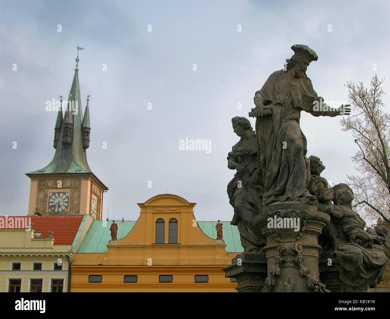 Statue on Charles Bridge of St. Ivo, with houses on Novotného lávka and ...