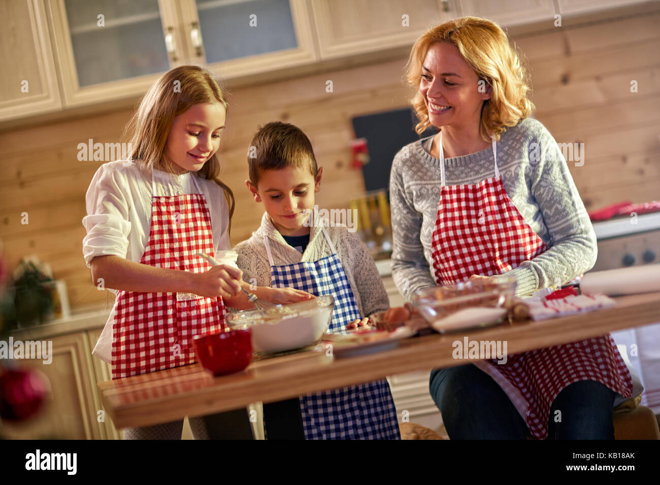 children and mother making Christmas cookies-Family time Stock Photo ...