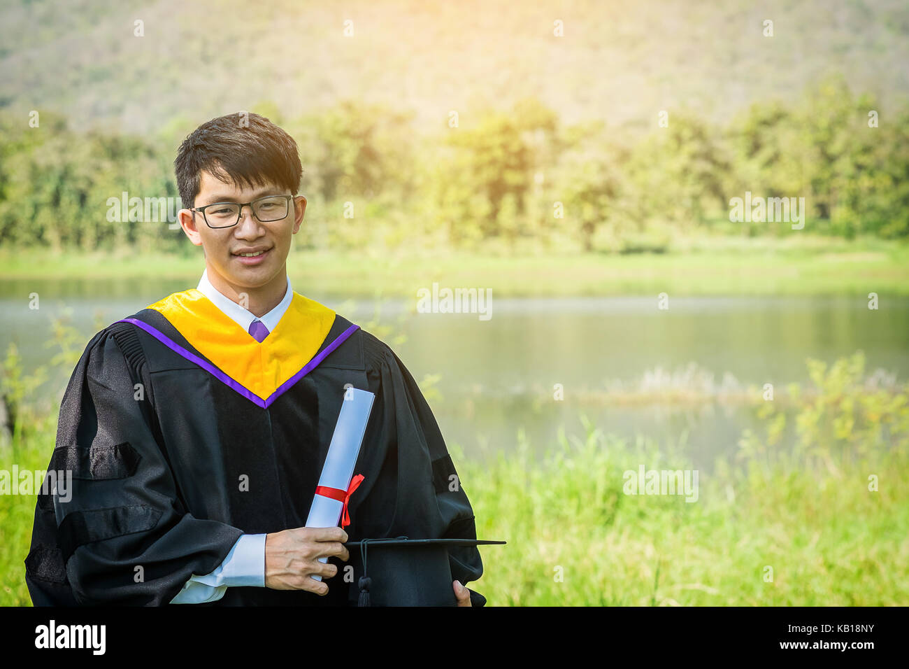 Graduation: Student smile holding certificate, graduation hat with ...