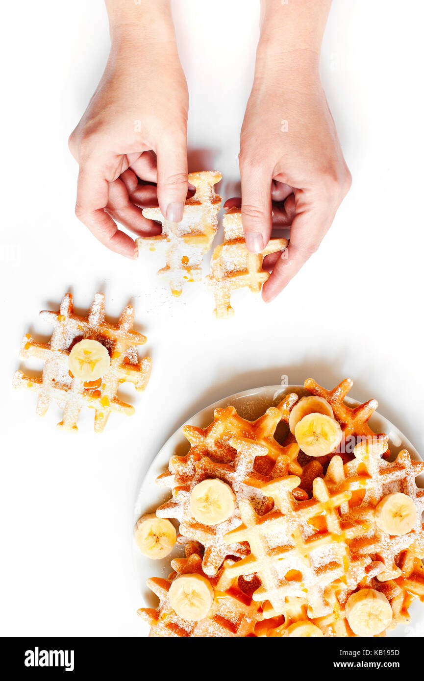 Female hands holding the fresh homemade waffles Stock Photo - Alamy