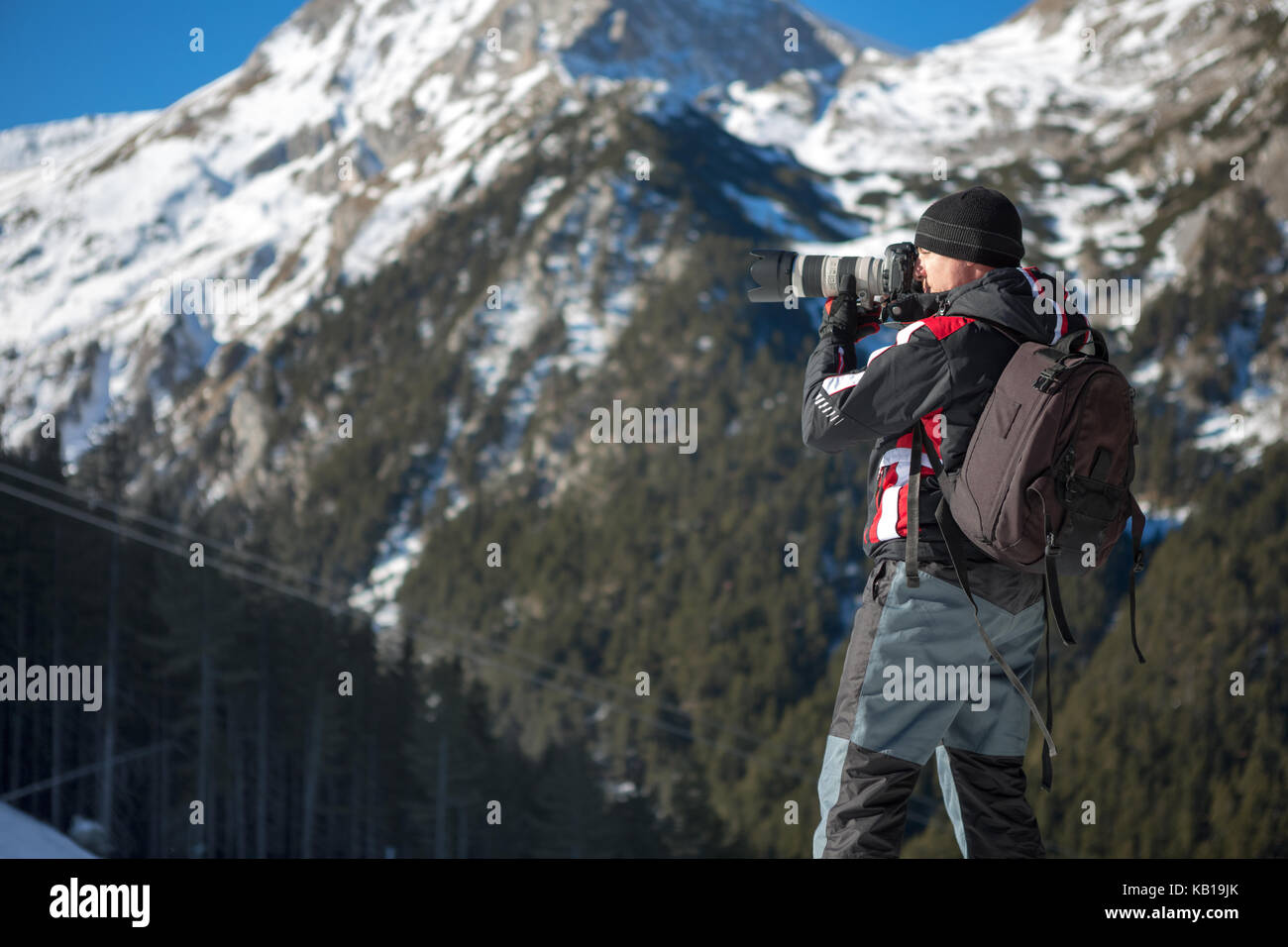 photographer getting picture of mountain view Stock Photo - Alamy