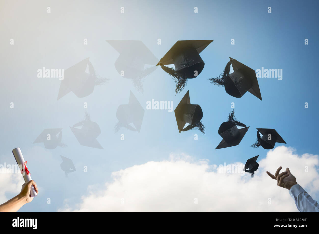 Graduation cap throwing hands hi-res stock photography and images - Alamy
