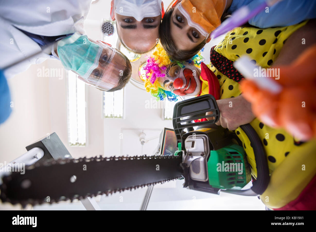 Scary delusion with dental team and crazy clown with chainsaw in bottom ...