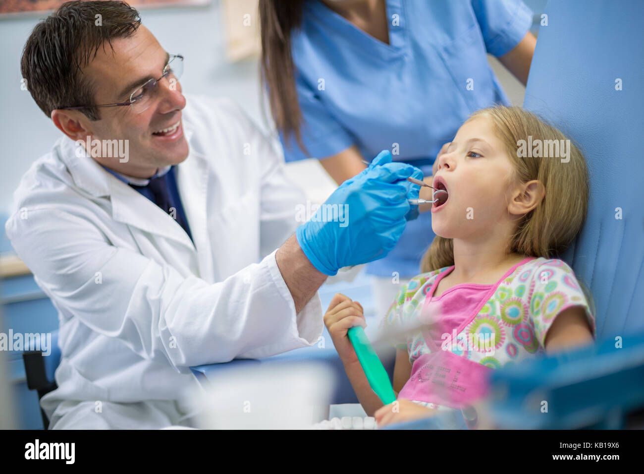 Young girl on teeth check up at dental clinic Stock Photo - Alamy