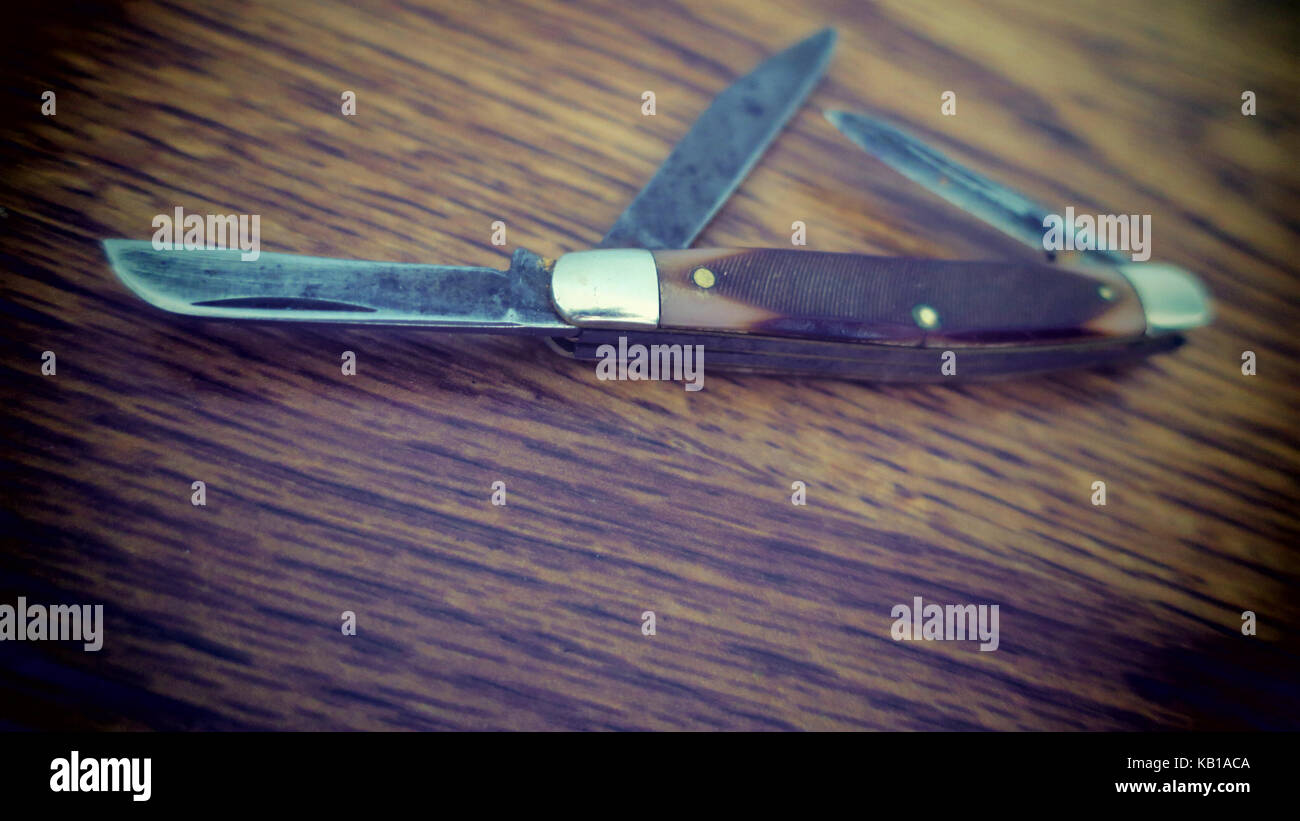 A vintage grungy knife blades on a table Stock Photo - Alamy